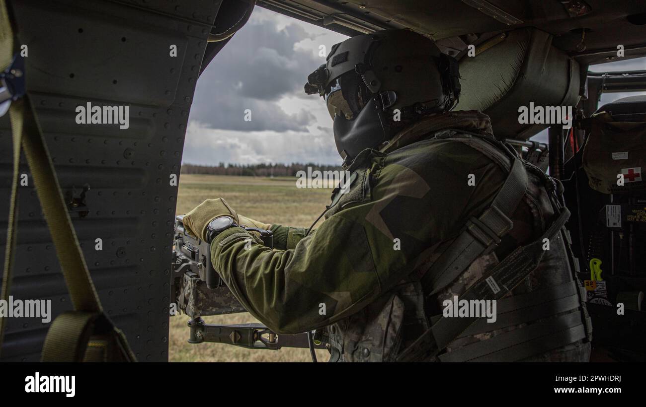 A Swedish Armed Forces crew chief with the 21st Helicopter Division ...