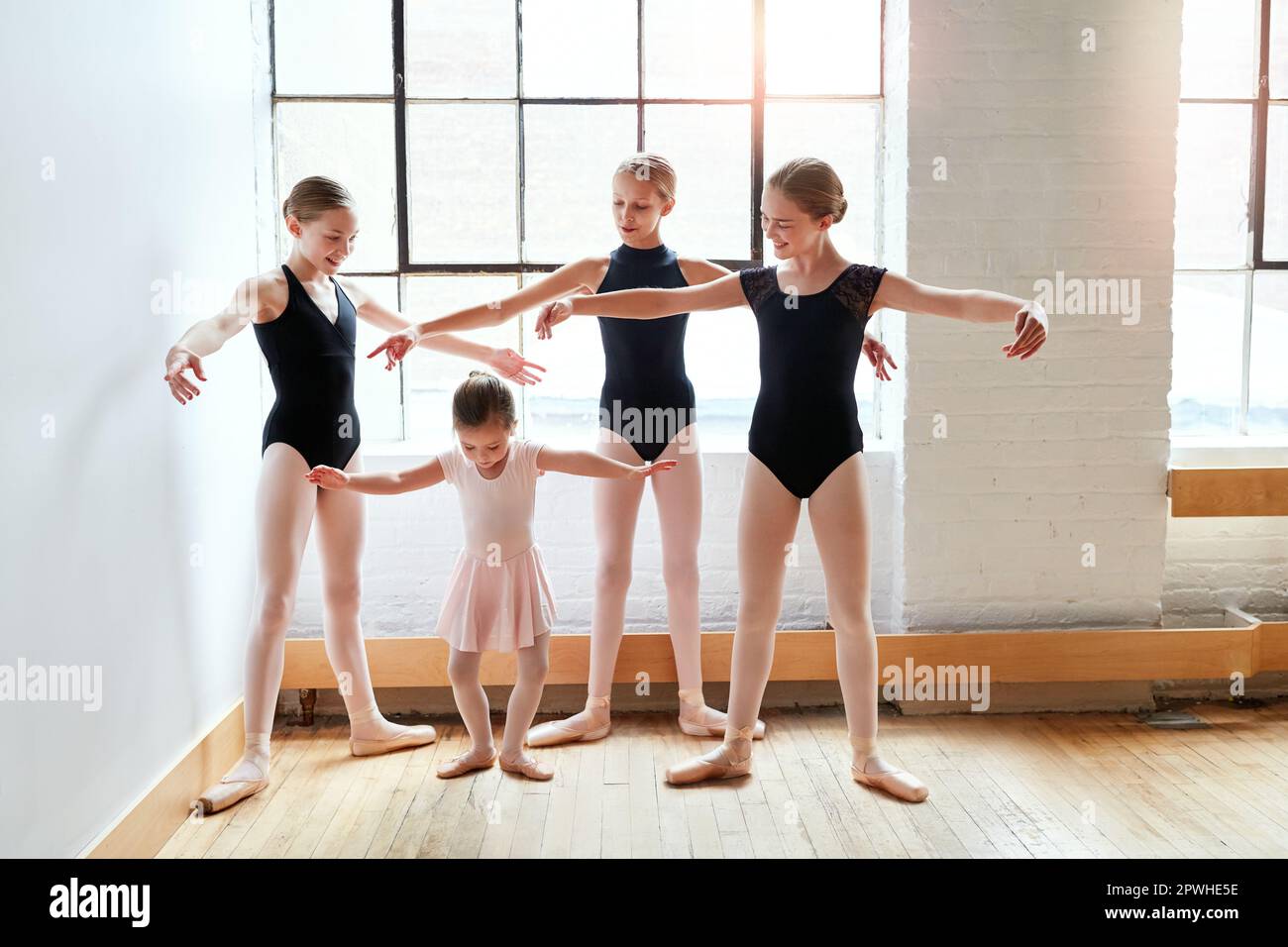 Practice makes every pointe perfect. a group of young ballerinas ...