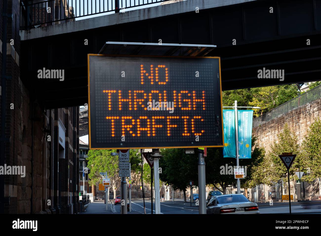 Traffic warning sign on city street reading no through traffic Stock ...