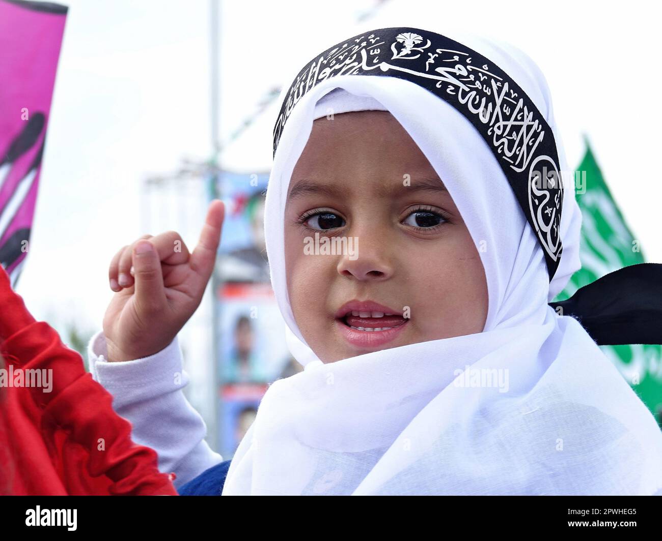 A little girl participates in an event to celebrate the birthday of the ...