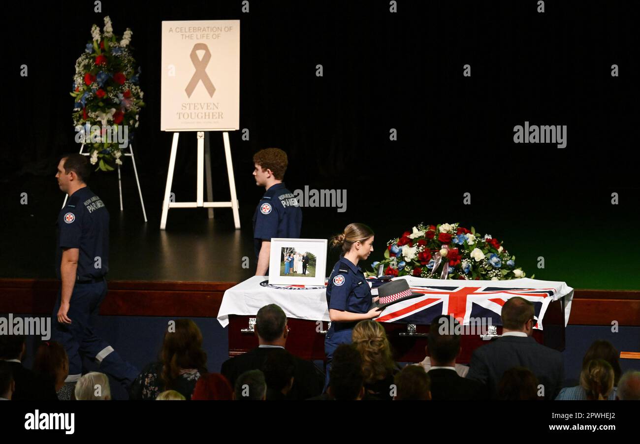 People attend the memorial for paramedic Steven Tougher at the ...
