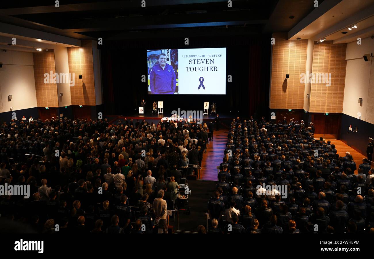 People attend the memorial for paramedic Steven Tougher at the ...