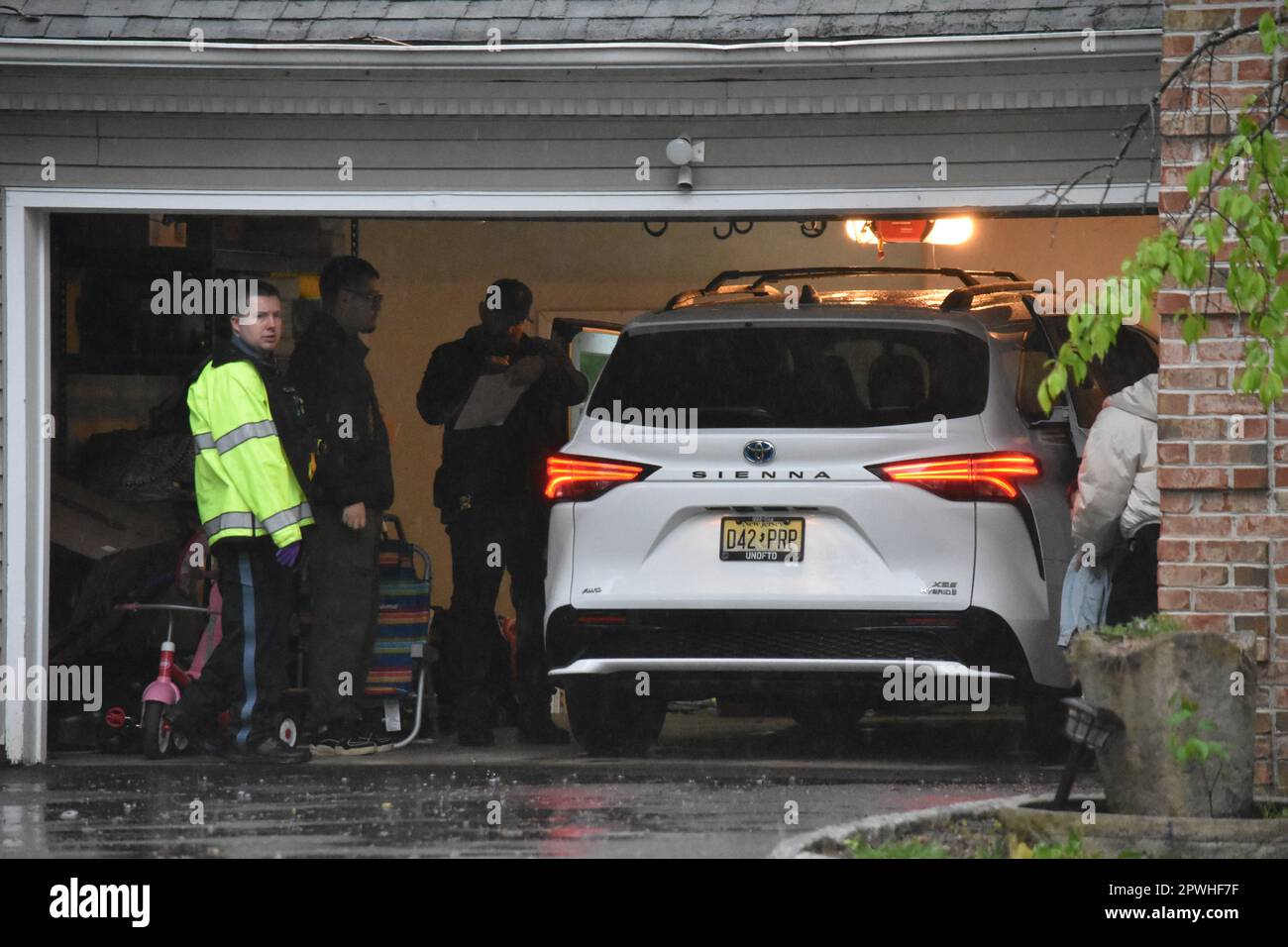 Ridgewood, United States. 30th Apr, 2023. Investigators communicate ...