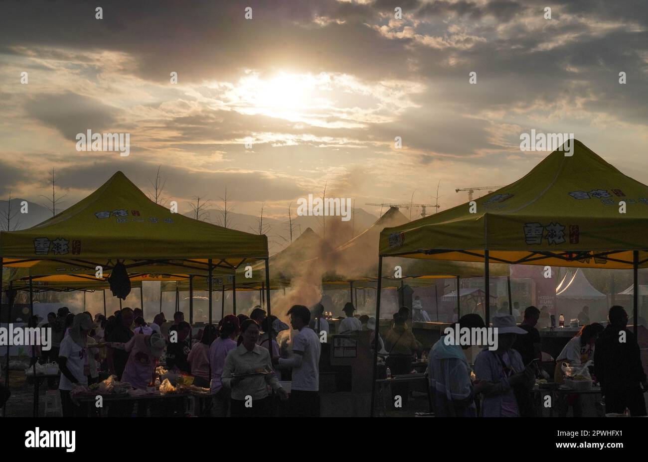 XICHANG, CHINA - APRIL 30, 2023 - Tourist enjoy an open-air barbecue at ...