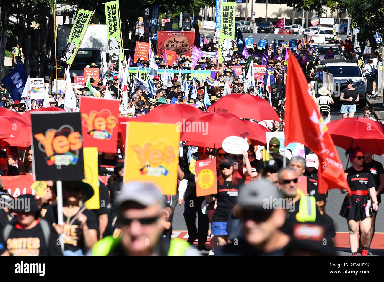 Signs are seen during the May Day march in Brisbane, Monday, May 1 ...