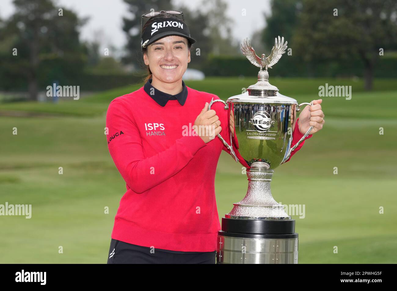 Hannah Green poses for photos with the winner's trophy after winning in a playoff in the LPGA LA ...