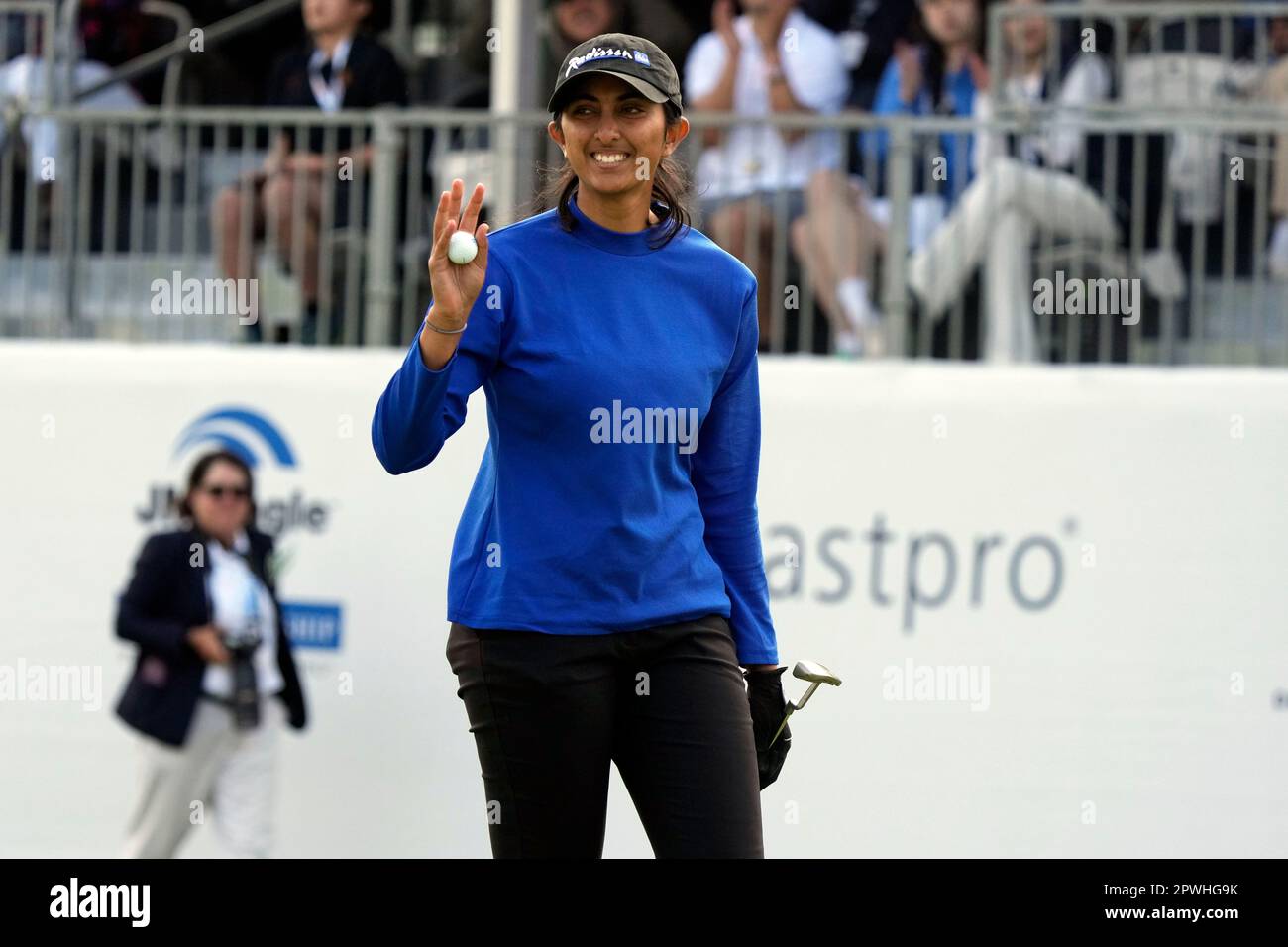 Aditi Ashok waves to the gallery after finishing on the 18th green in ...