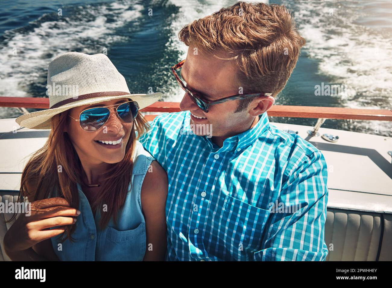 When life gives you water, go boating. a young couple spending time ...