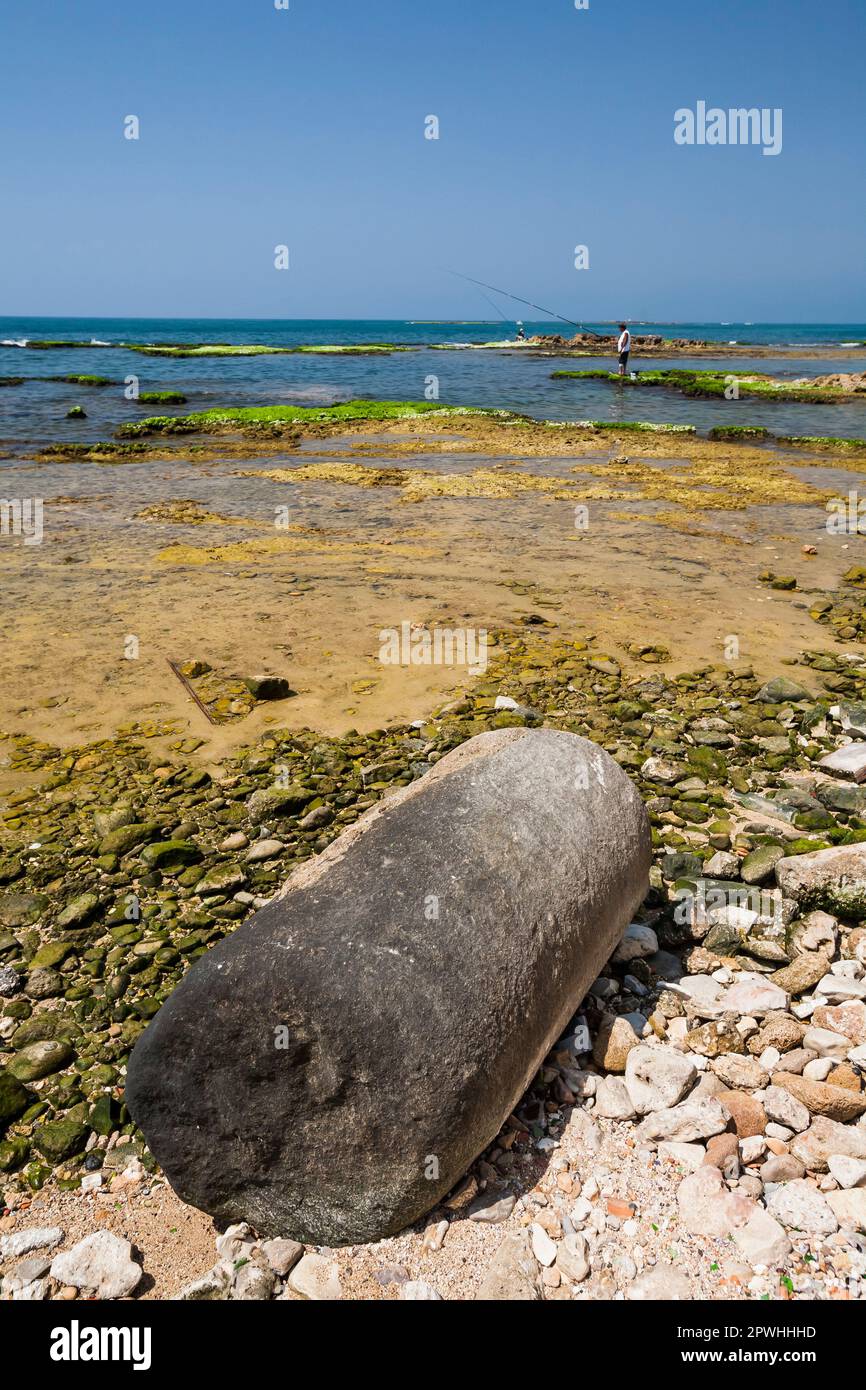 Ancient stone column at rock reef, tip of peninsula, mediterranean sea ...