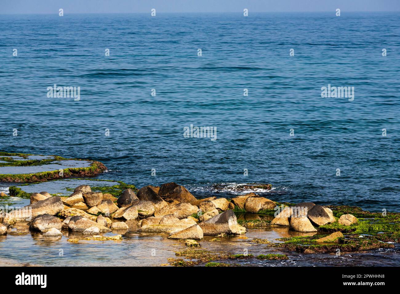Ancient stone columns at rock reef, tip of peninsula(ancient island ...