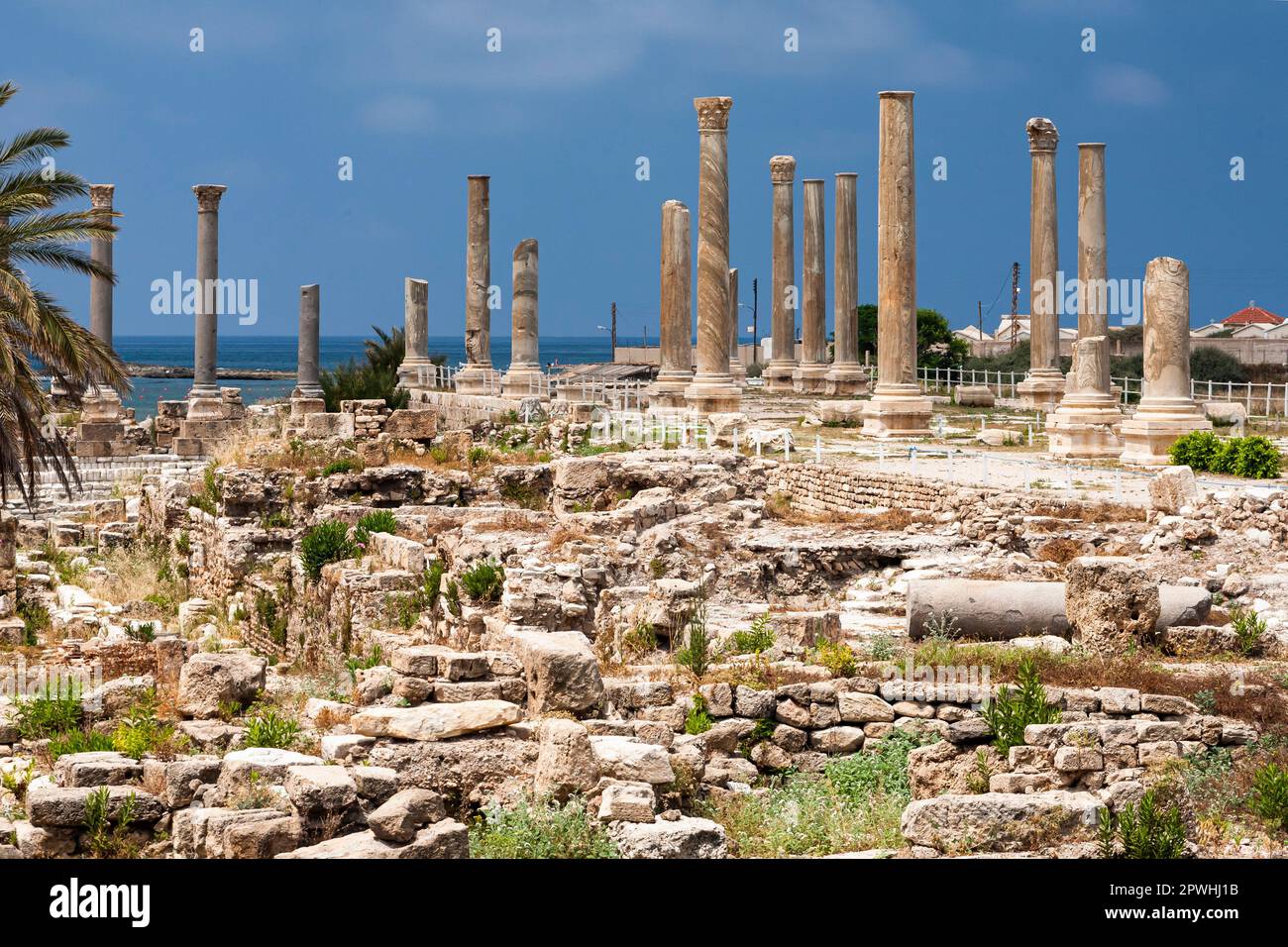 Roman ruins and columns at tip of Tyre peninsula, mediterranean sea ...