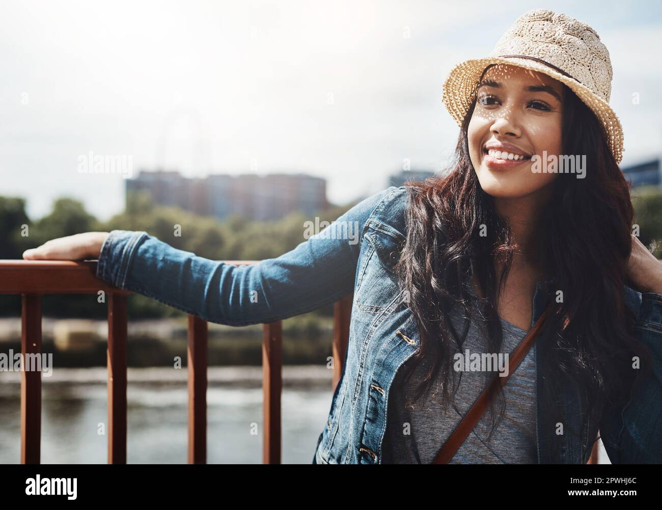Shes always ready to smile. a beautiful young woman spending her day in ...