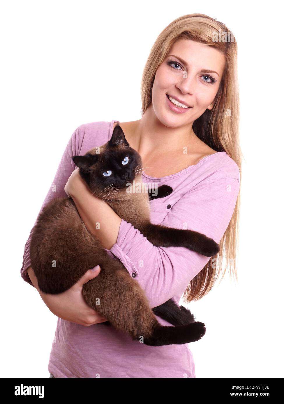 young woman holding siamese cat in her arms Stock Photo - Alamy