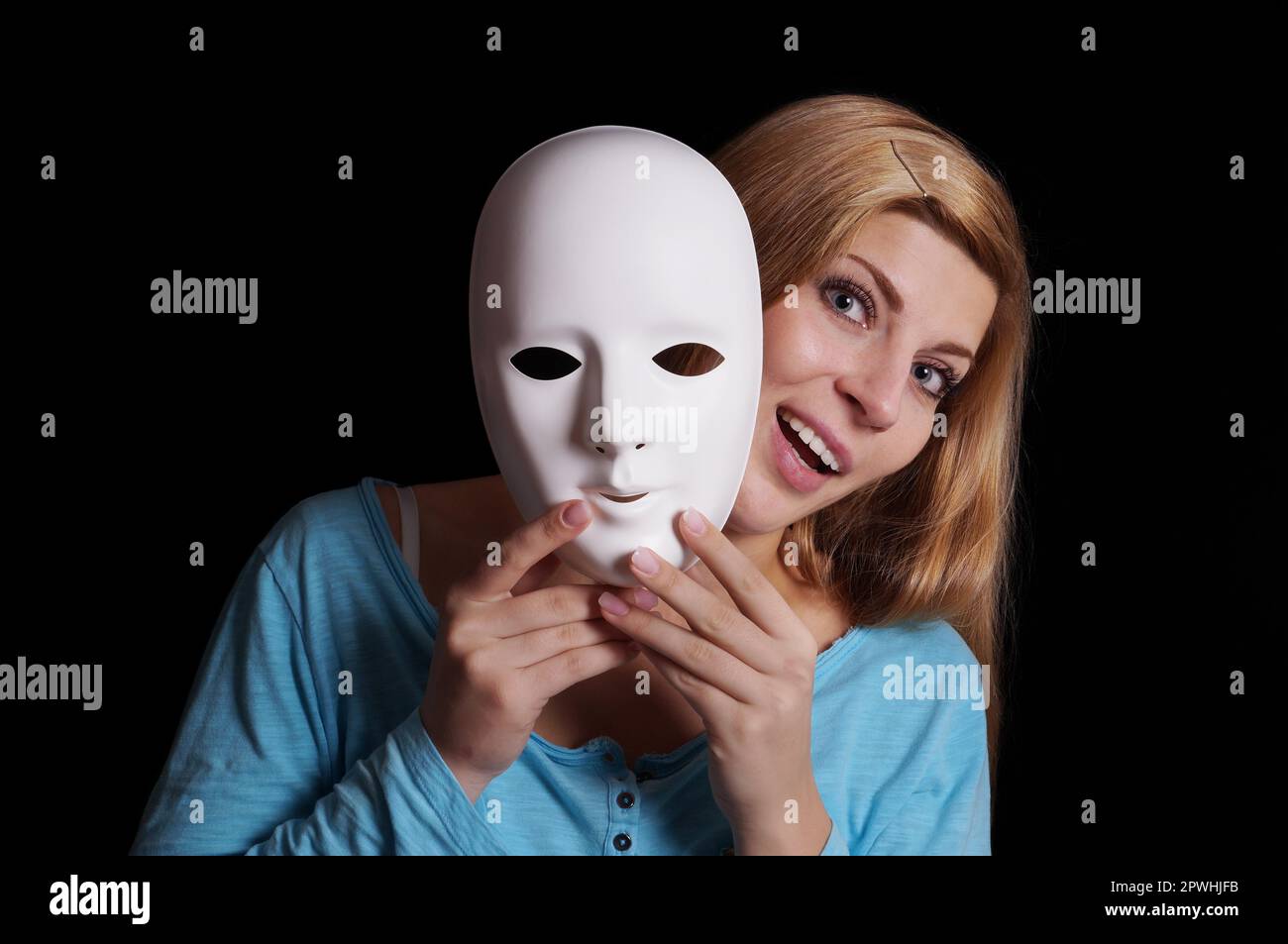 young woman removing plain white mask from her face Stock Photo - Alamy