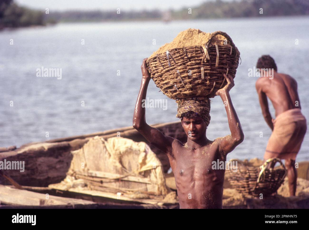 Collecting sand from Gurpura River near Sultan Battery, Mangalore ...