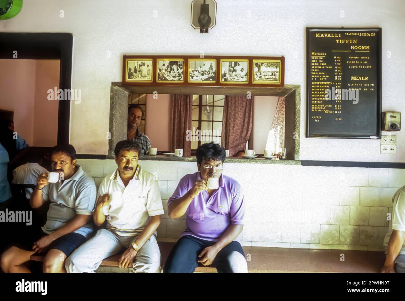 People drinking coffee in the famous Mavalli Tiffin Rooms in Bengaluru ...