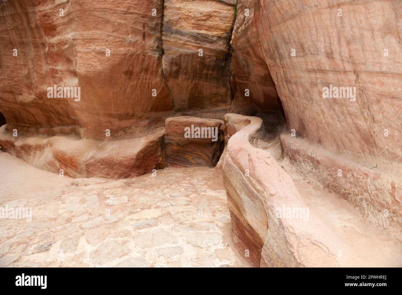 Ancient water conduit in Siq, canyon, gorge, ancient paving stones ...