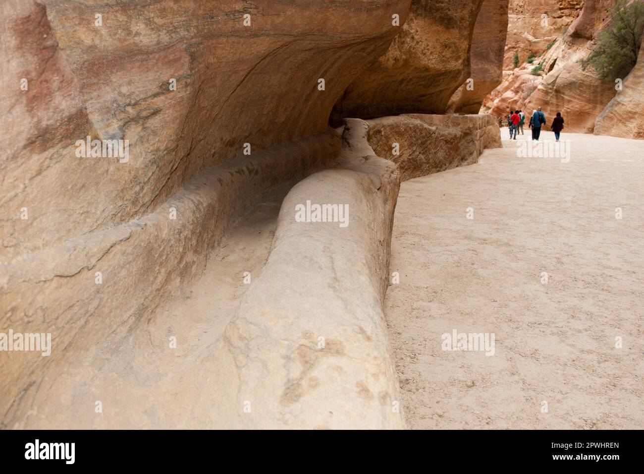 Ancient water conduit in Siq, canyon, gorge, ancient paving stones ...