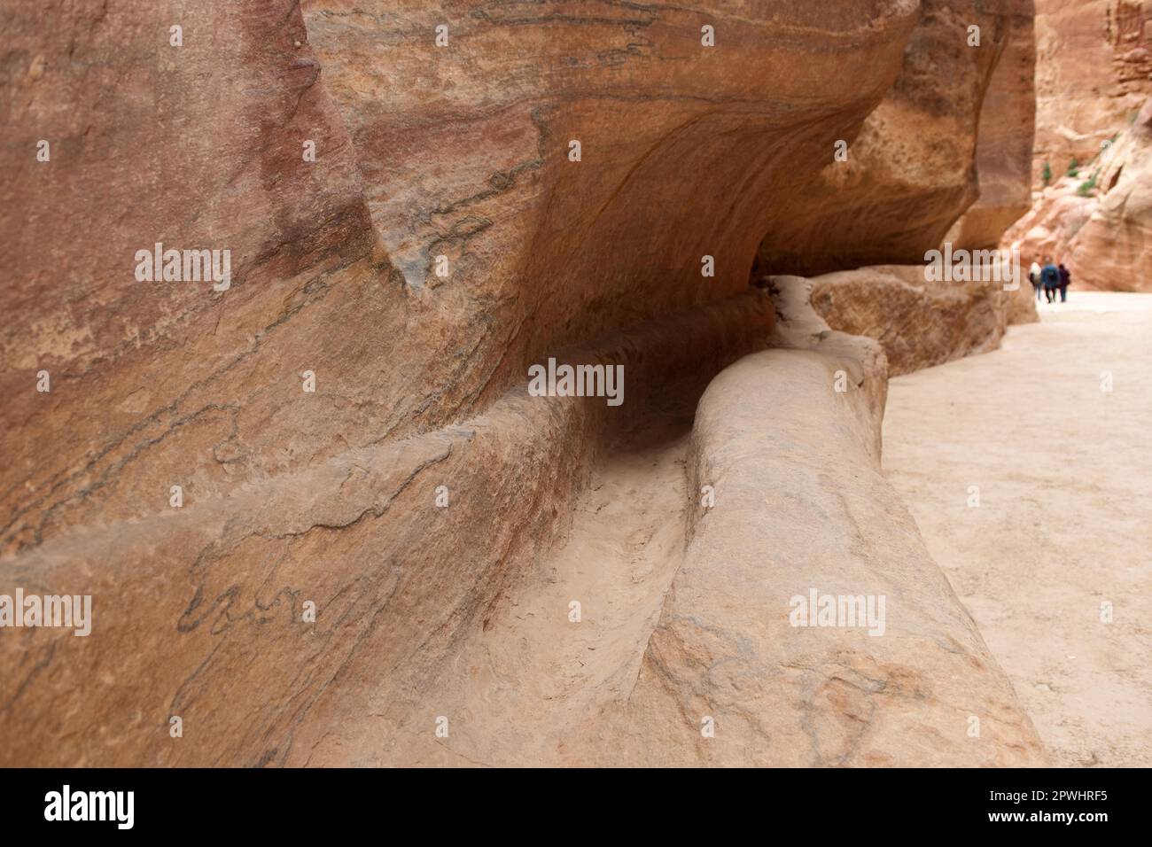 Ancient water conduit in Siq, canyon, gorge, ancient paving stones ...