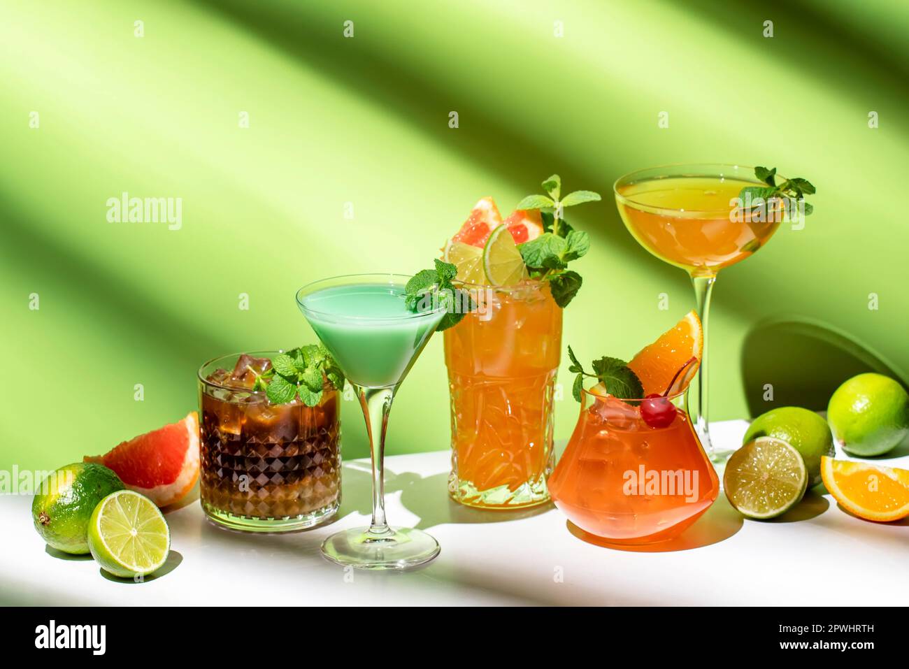 Alcoholic drinks with mint, summer cocktail party. Multi-colored low ...