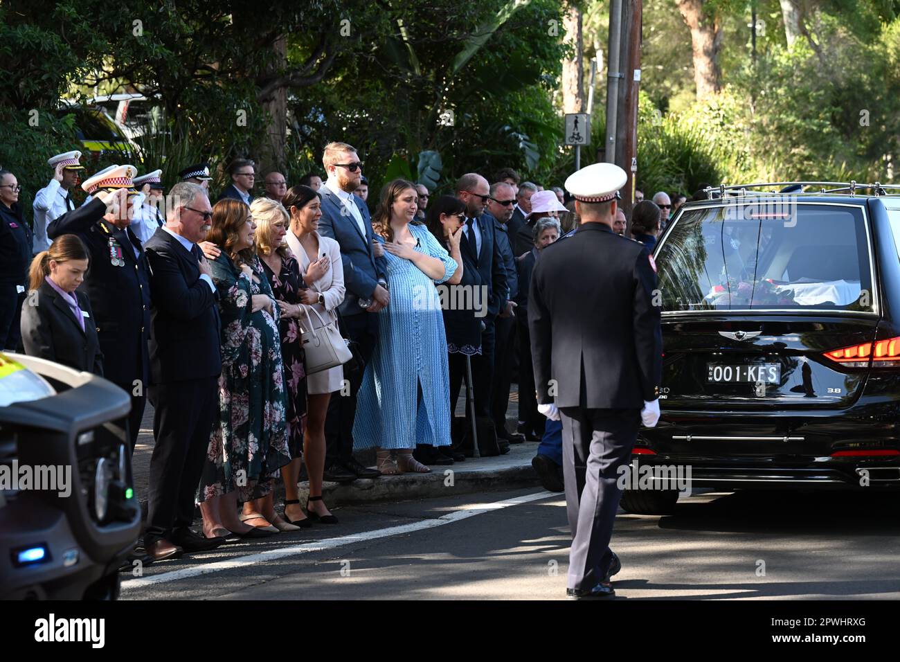 The family of Steve Tougher join a guard of honour, made up of NSW ...