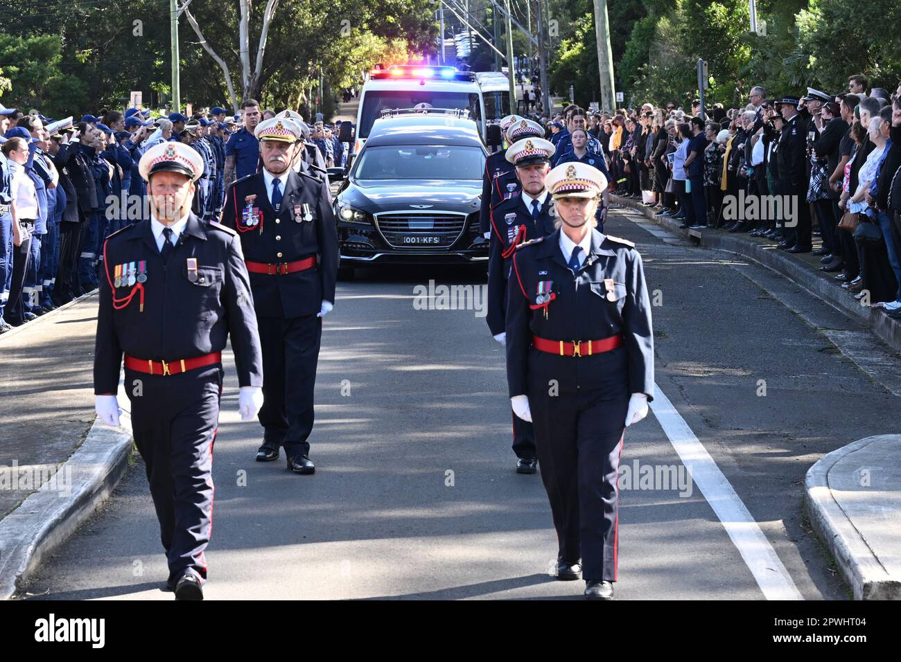The herse carrying the casket of Steven Tougher makes it’s way through ...