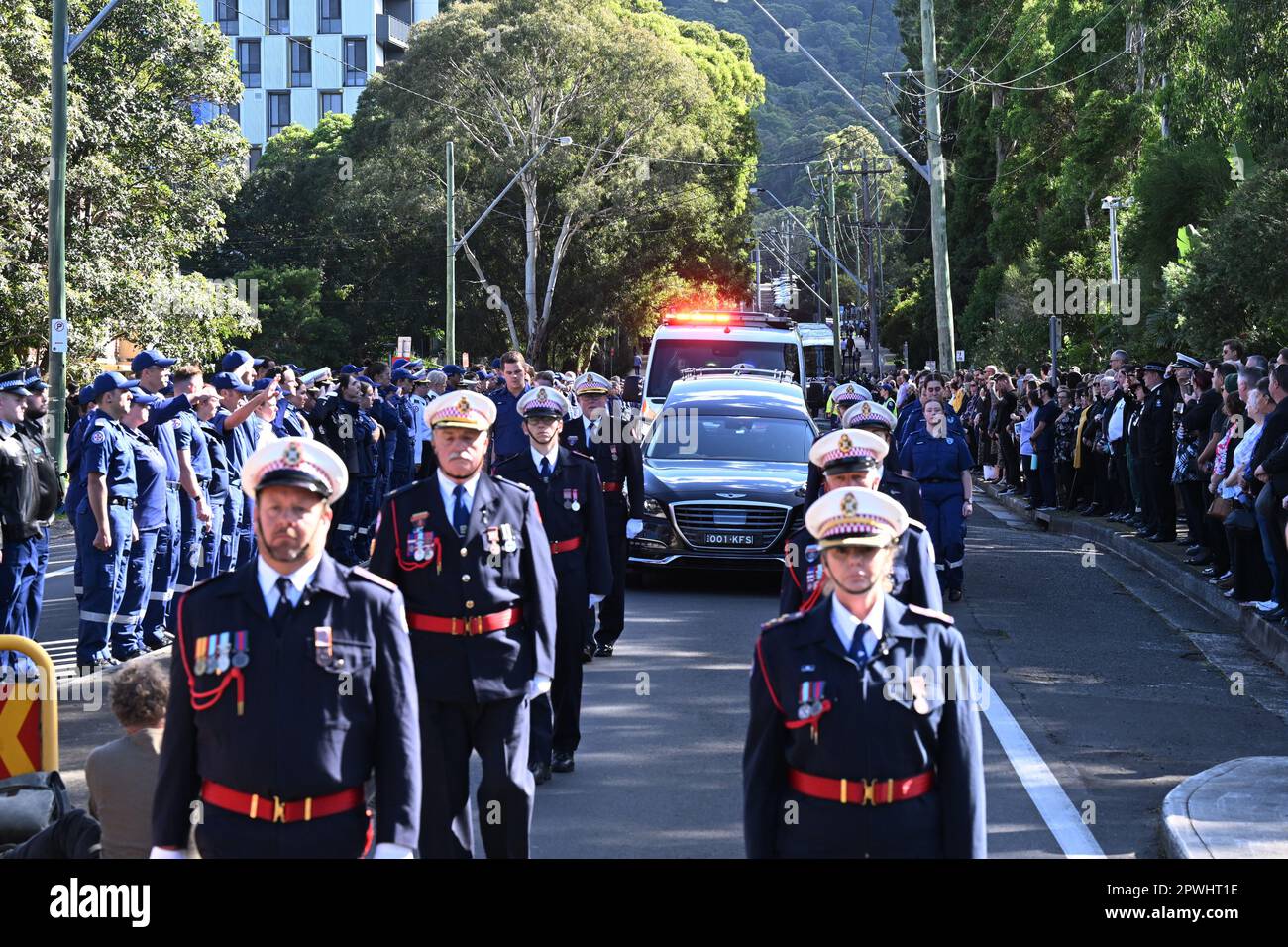 The herse carrying the casket of Steven Tougher makes it’s way through ...