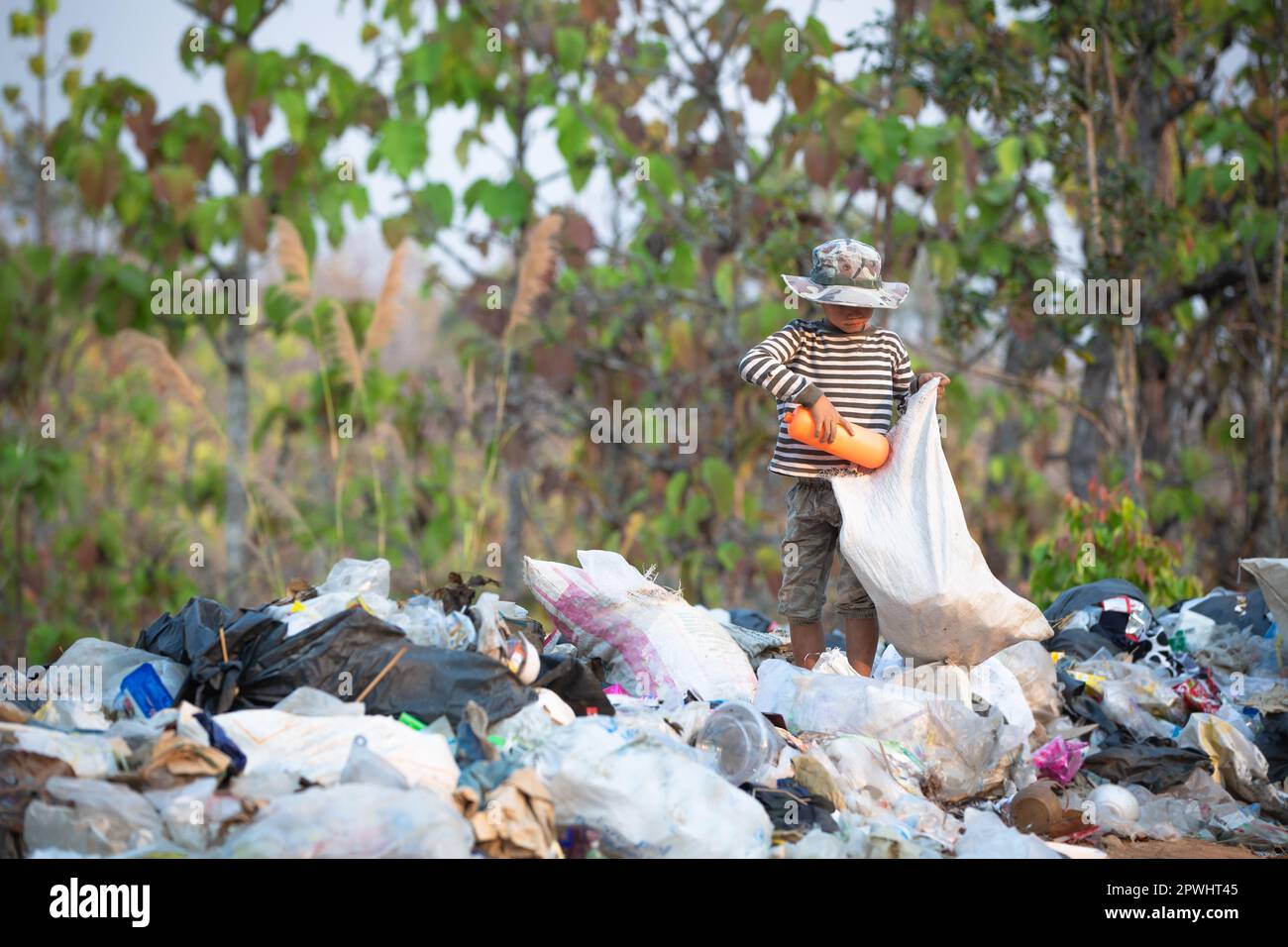 Poor children collect and sort waste for sale, concepts of poverty and ...