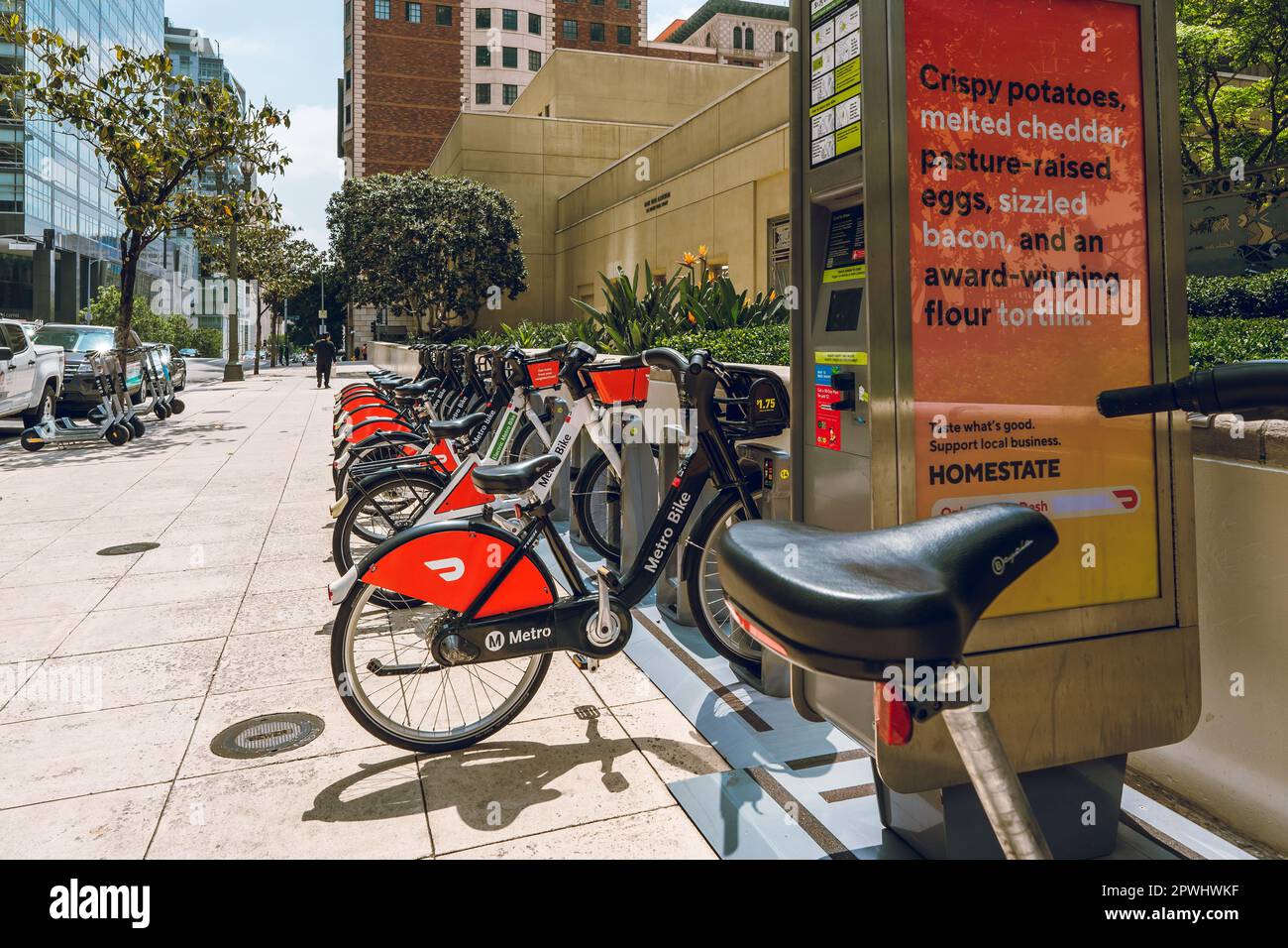 Los Angeles, California, USA - April 25, 2023. Metro bikes are parked ...