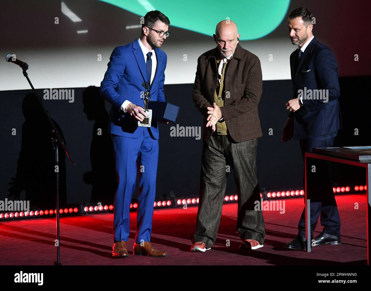 Krakow, Poland. 28th Apr, 2023. Szymon Miszczak (L) John Malkovich (C ...