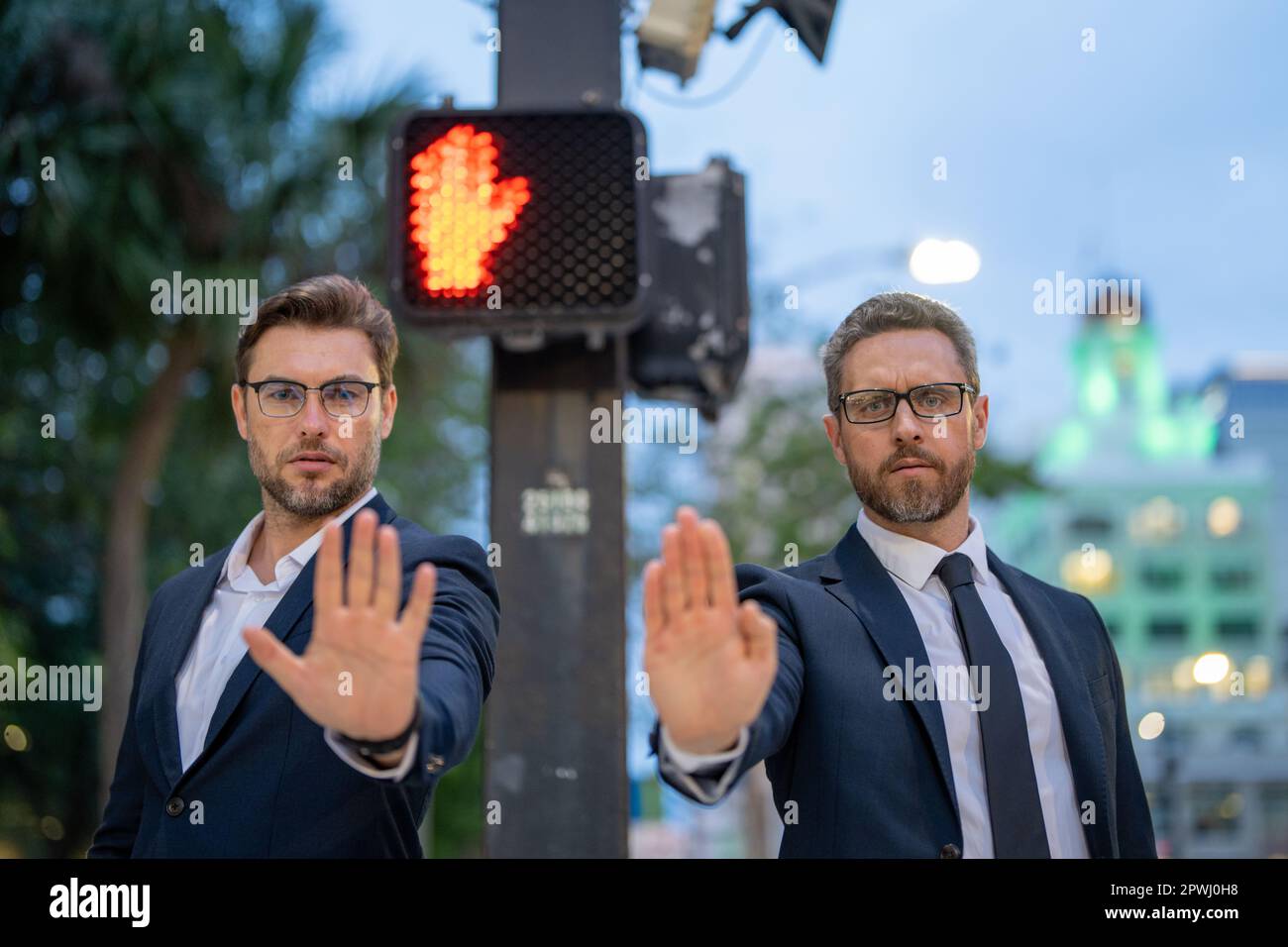 Businessmen doing stop sing with hand. Warning expression with negative ...
