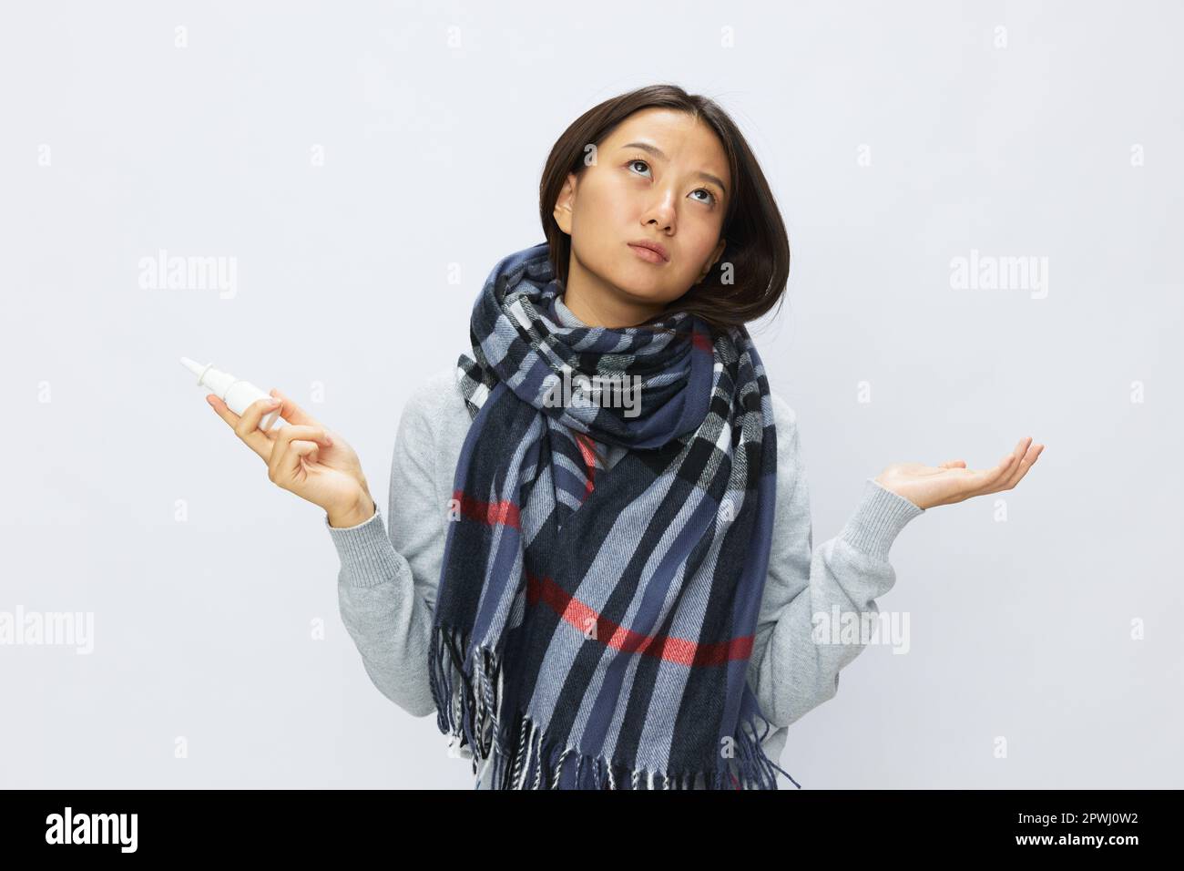 Asian woman flu cold with stuffy nose holds allergy and covid 19 virus ...