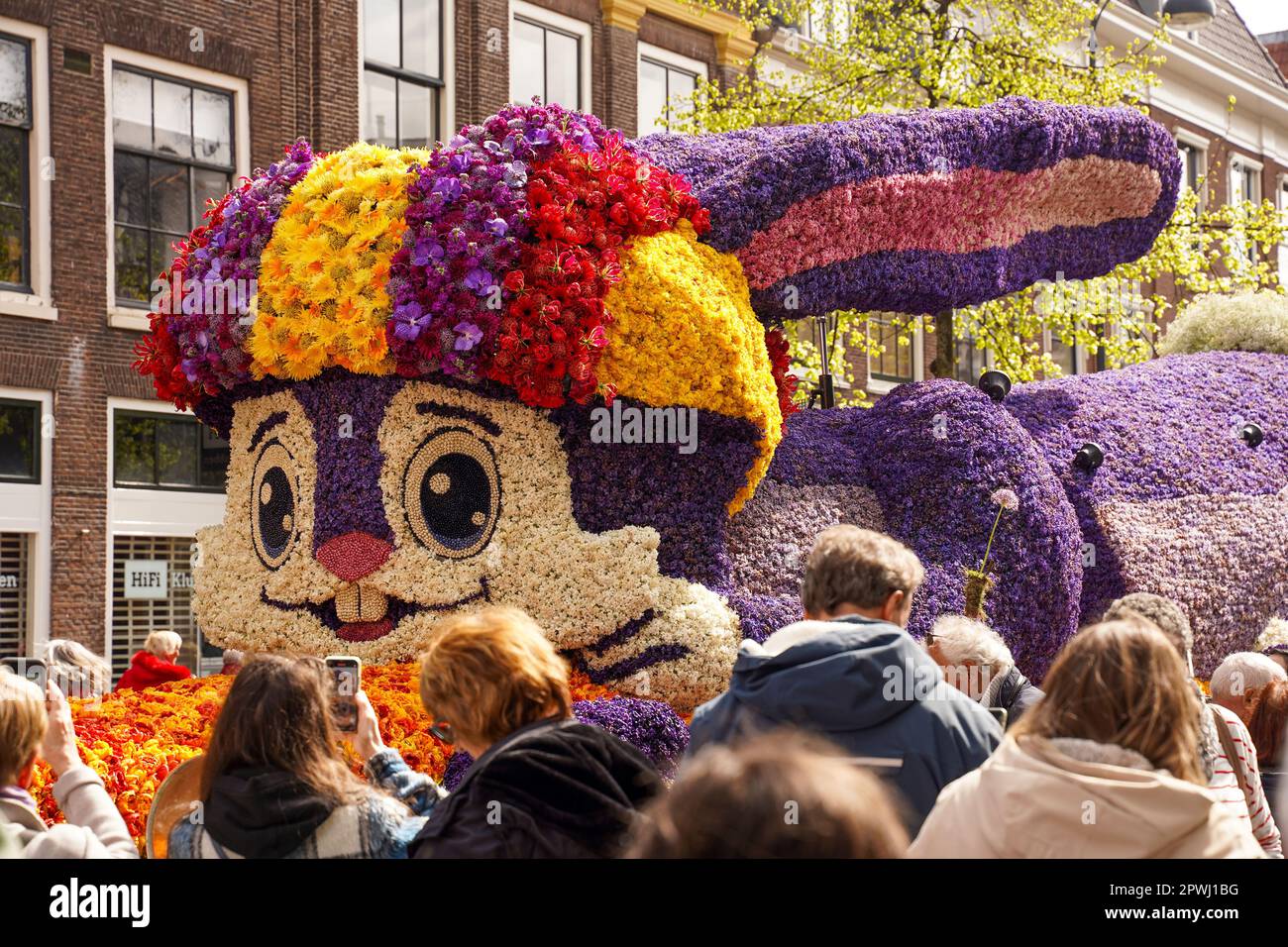 Haarlem, Netherlands-April 23, 2023: Hare in a cap from flowers. Procession of flowers ...
