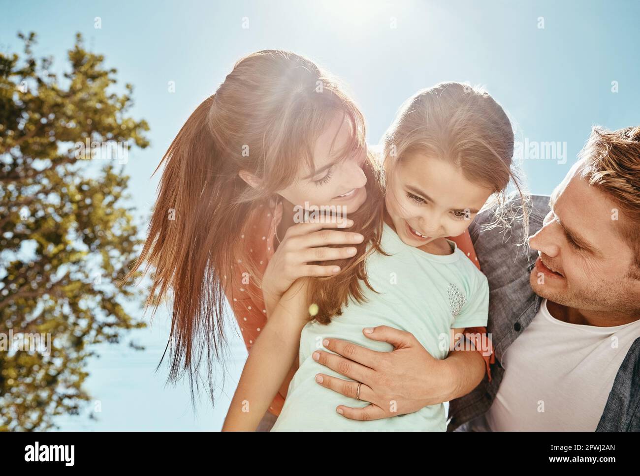 The love of a family. a family bonding together outdoors Stock Photo ...