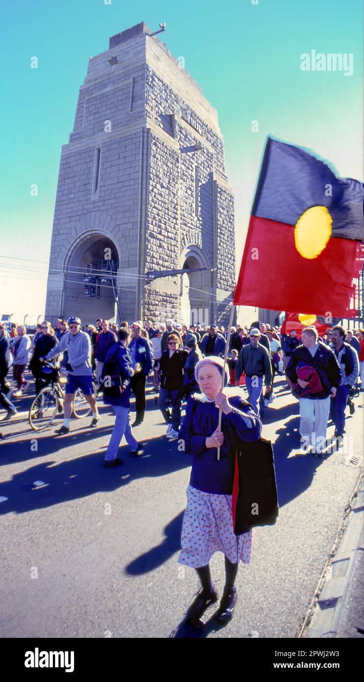 A woman with an indigenous flag at Sydney Harbour Bridge on 28 May 2000 ...