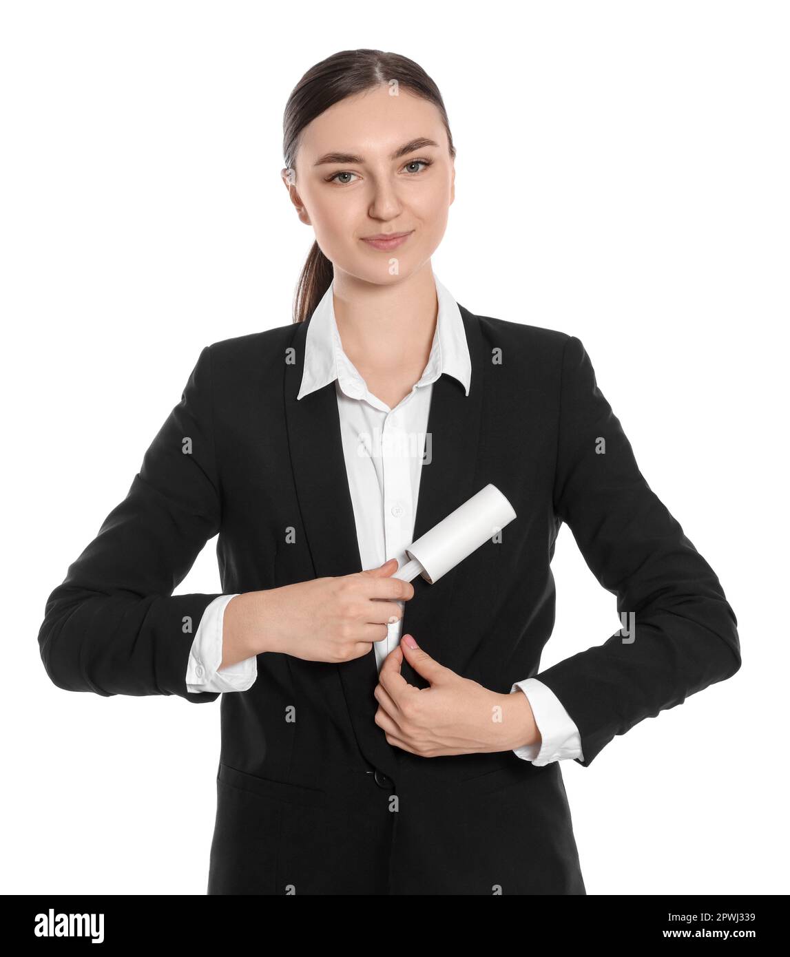 Young woman cleaning suit with lint roller on white background Stock ...