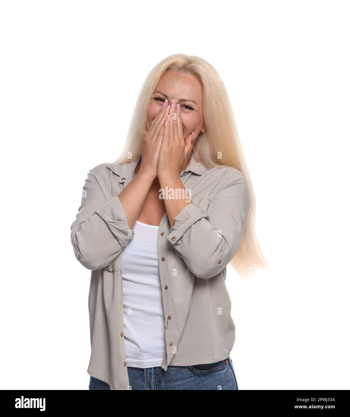 Embarrassed woman covering mouth with hands on white background Stock ...