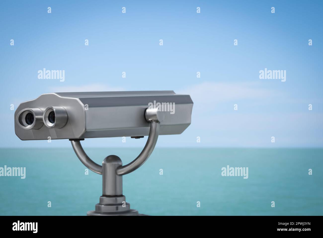 Metal tower viewer installed near sea, space for text. Mounted ...