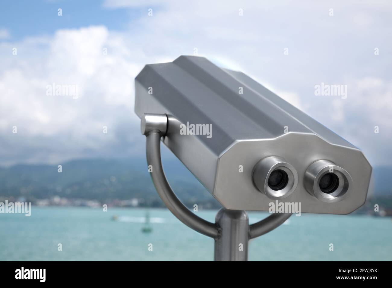 Metal tower viewer installed near sea. Mounted binoculars Stock Photo ...