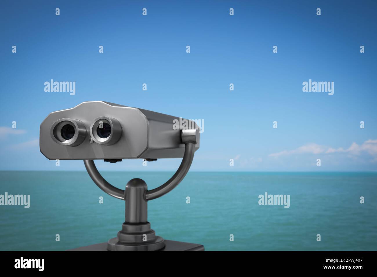 Metal tower viewer installed near sea, space for text. Mounted ...