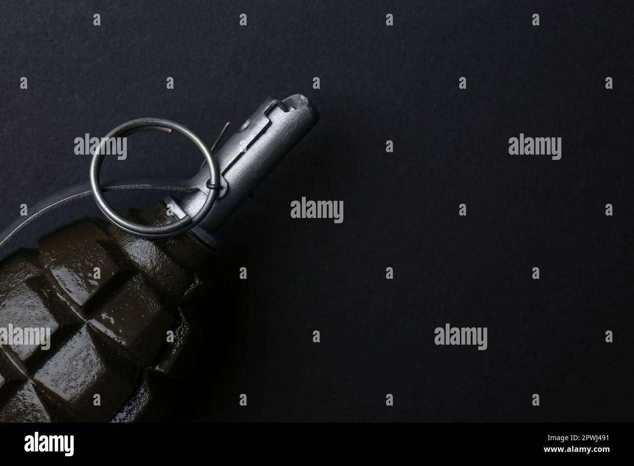 Hand grenade on black background, closeup. Space for text Stock Photo ...
