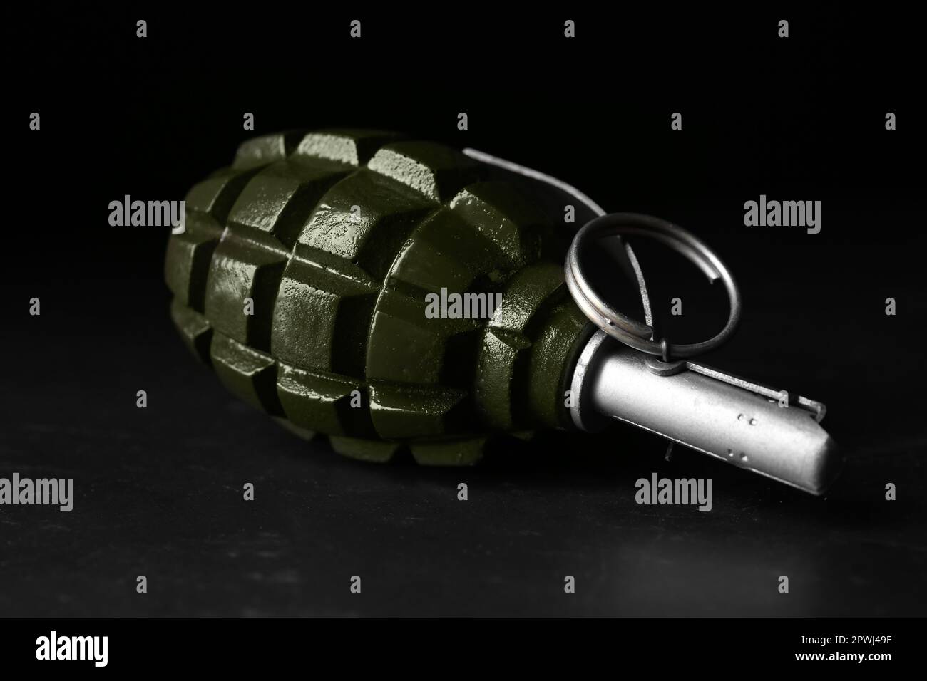 Hand grenade on black background, closeup. Explosive weapon Stock Photo ...