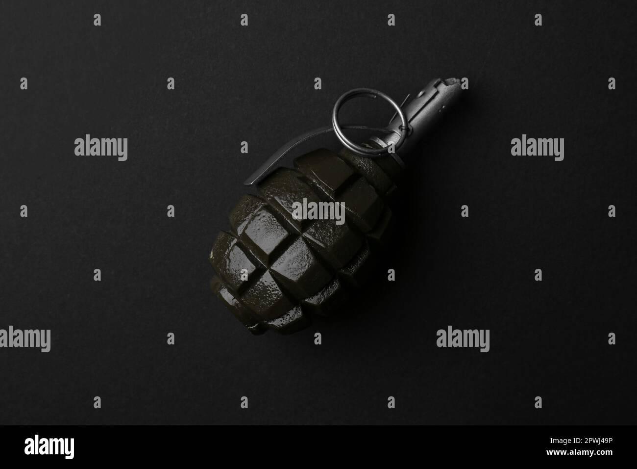 Hand grenade on black background, top view Stock Photo - Alamy