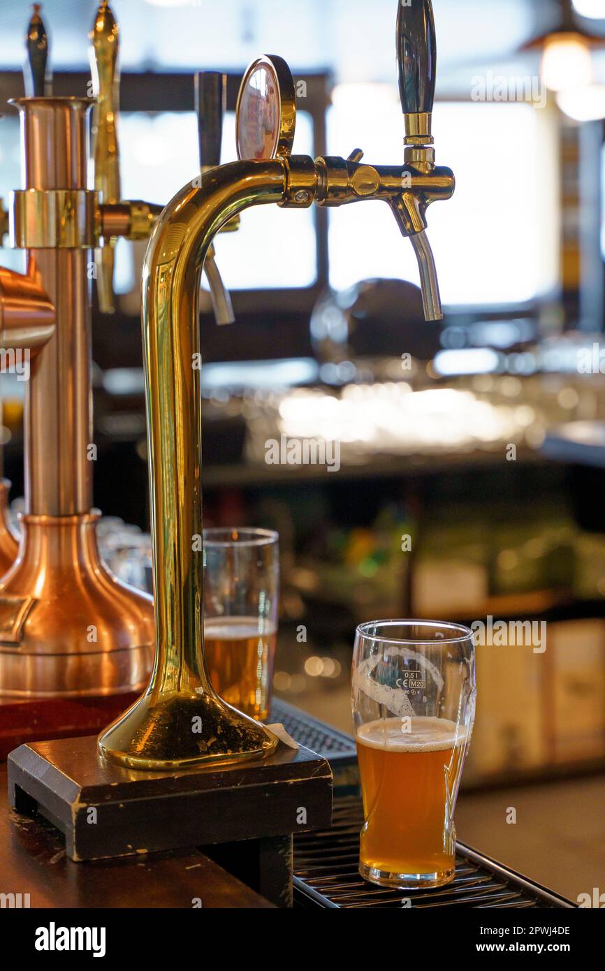 Beer pub bar. Beer taps with beer in a restaurant. High quality photo ...