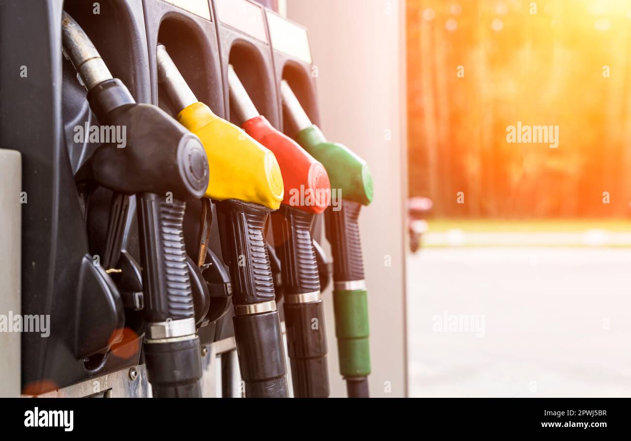 gas station. Pistols with gasoline and diesel fuel at a car gas station ...