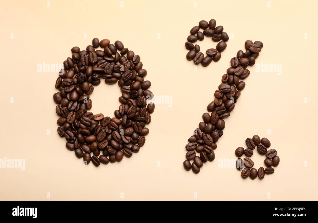 0 percent made of coffee beans on beige background, flat lay ...