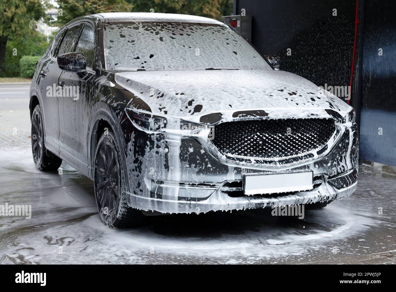 Luxury car covered cleaning foam hi-res stock photography and images ...