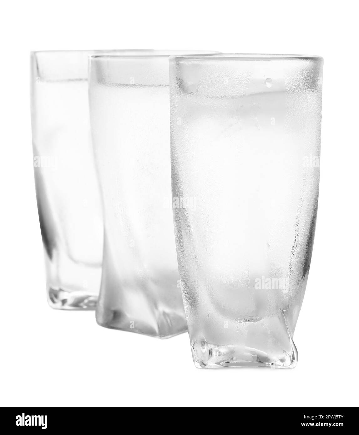 Vodka in shot glasses on white background Stock Photo - Alamy