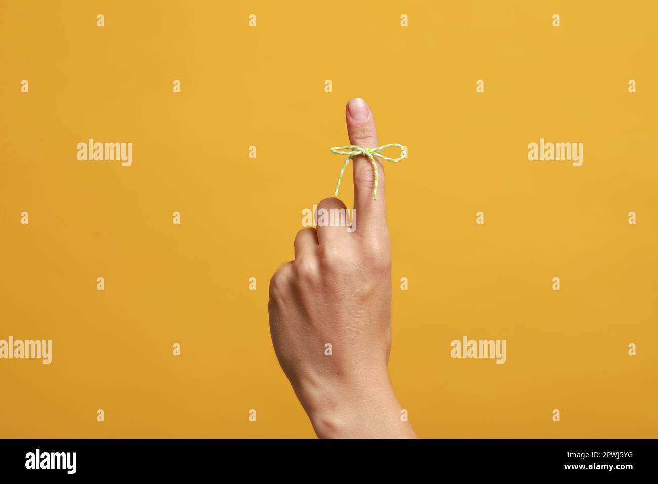 Woman index finger remember hi-res stock photography and images - Alamy