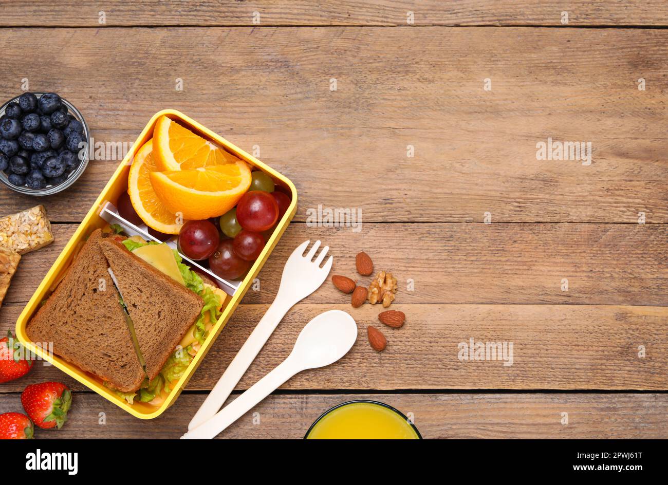 Flat lay composition with lunch box and tasty healthy food on wooden ...